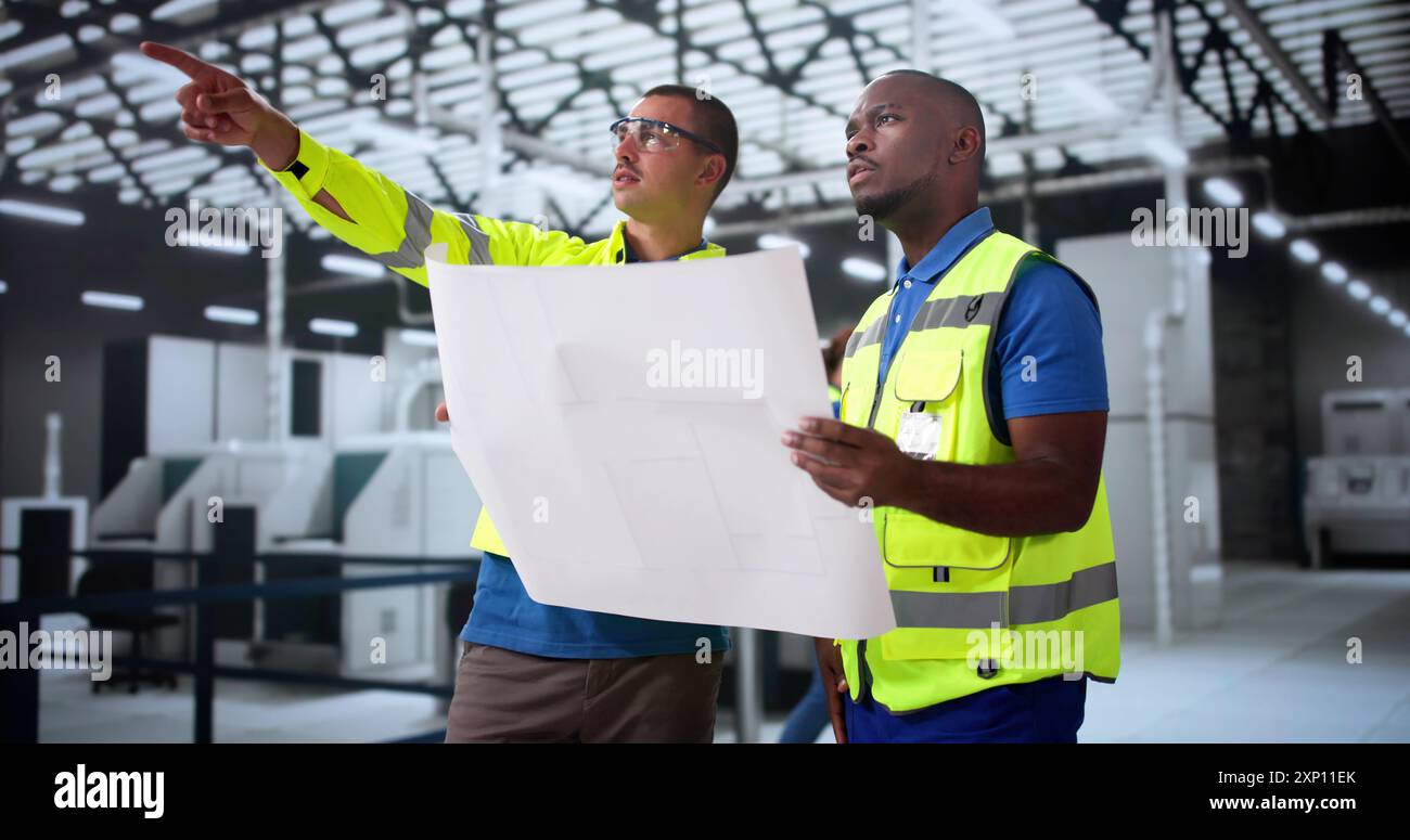 Factory Worker Osha Safety Inspection Using Blueprints Stock Photo - Alamy