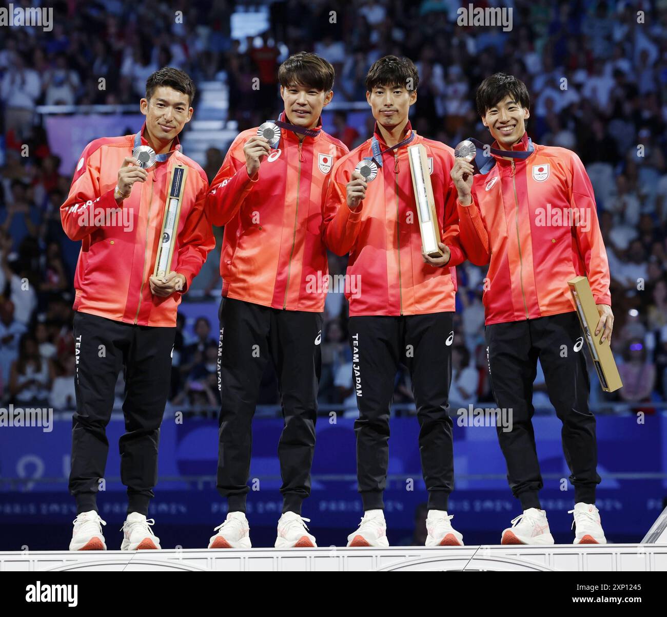 Japanese fencers (from L) Kazuyasu Minobe, Masaru Yamada, Akira Komata ...