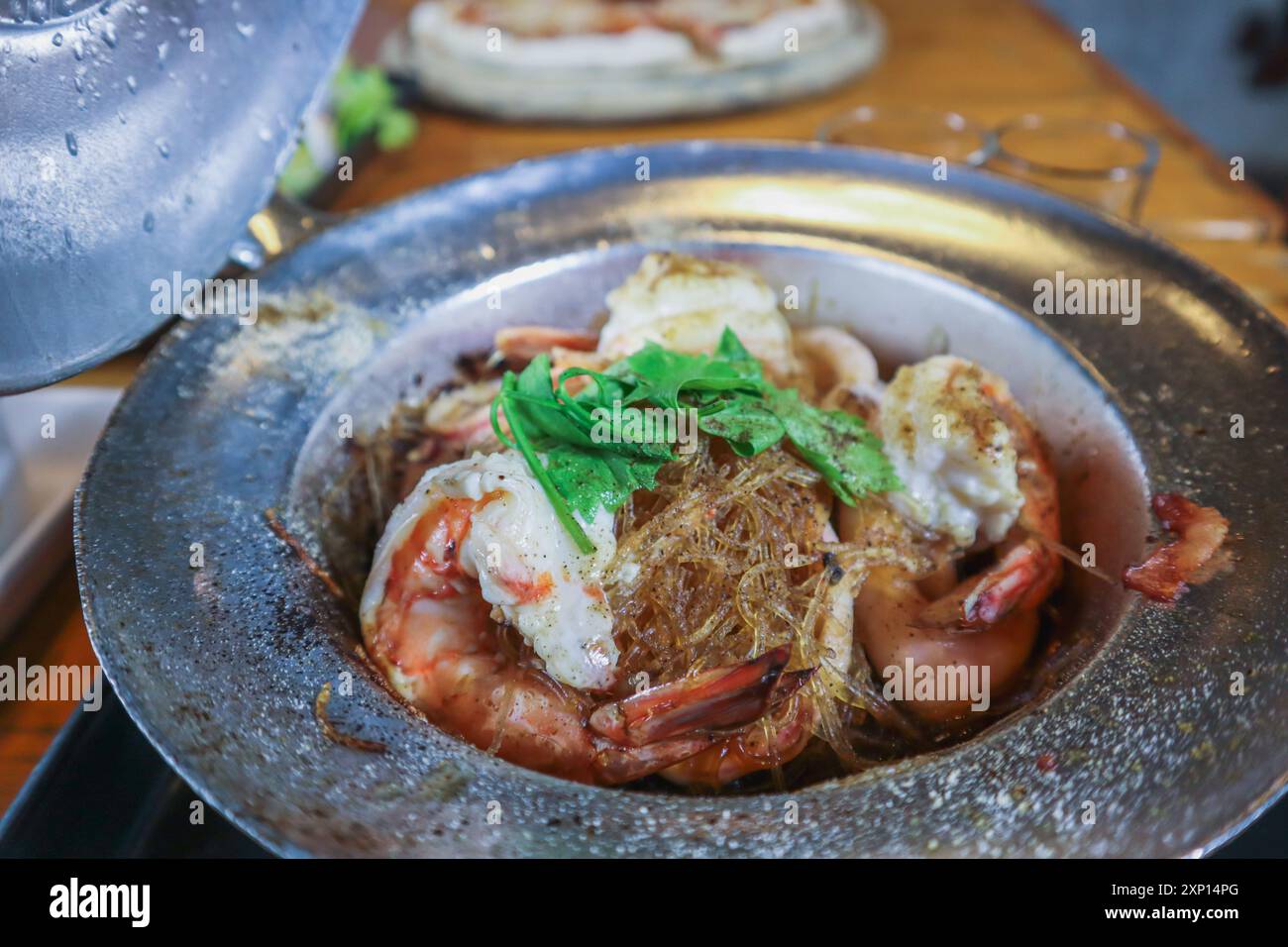 Baked river prawns with vermicelli in a pot is a very popular dish in ...