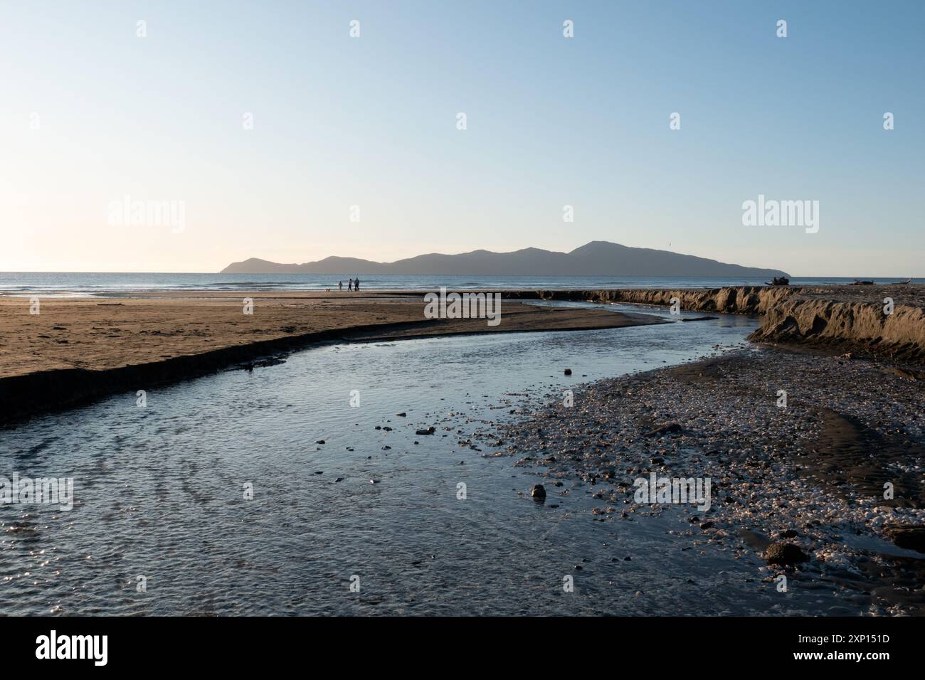 Wainui stream at Whareroa beach with Kapiti Island in the distance, in ...