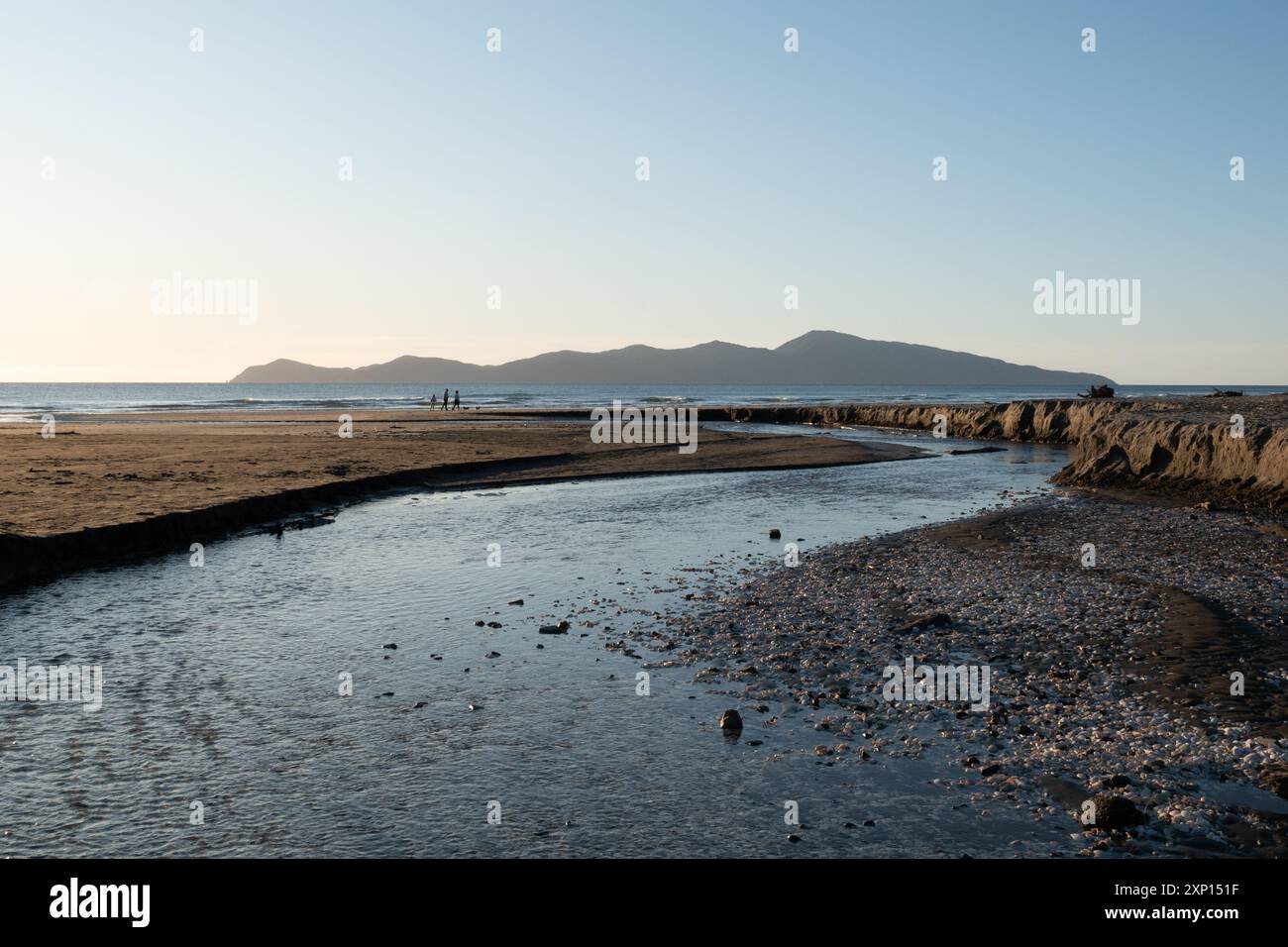 Wainui stream at Whareroa beach with Kapiti Island in the distance, in ...