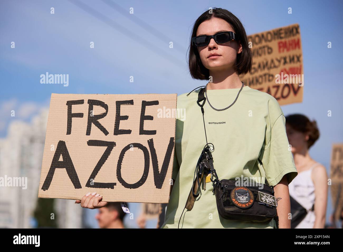 Ukrainian girl posing with a sign Free Azov on a demonstration. Kyiv ...