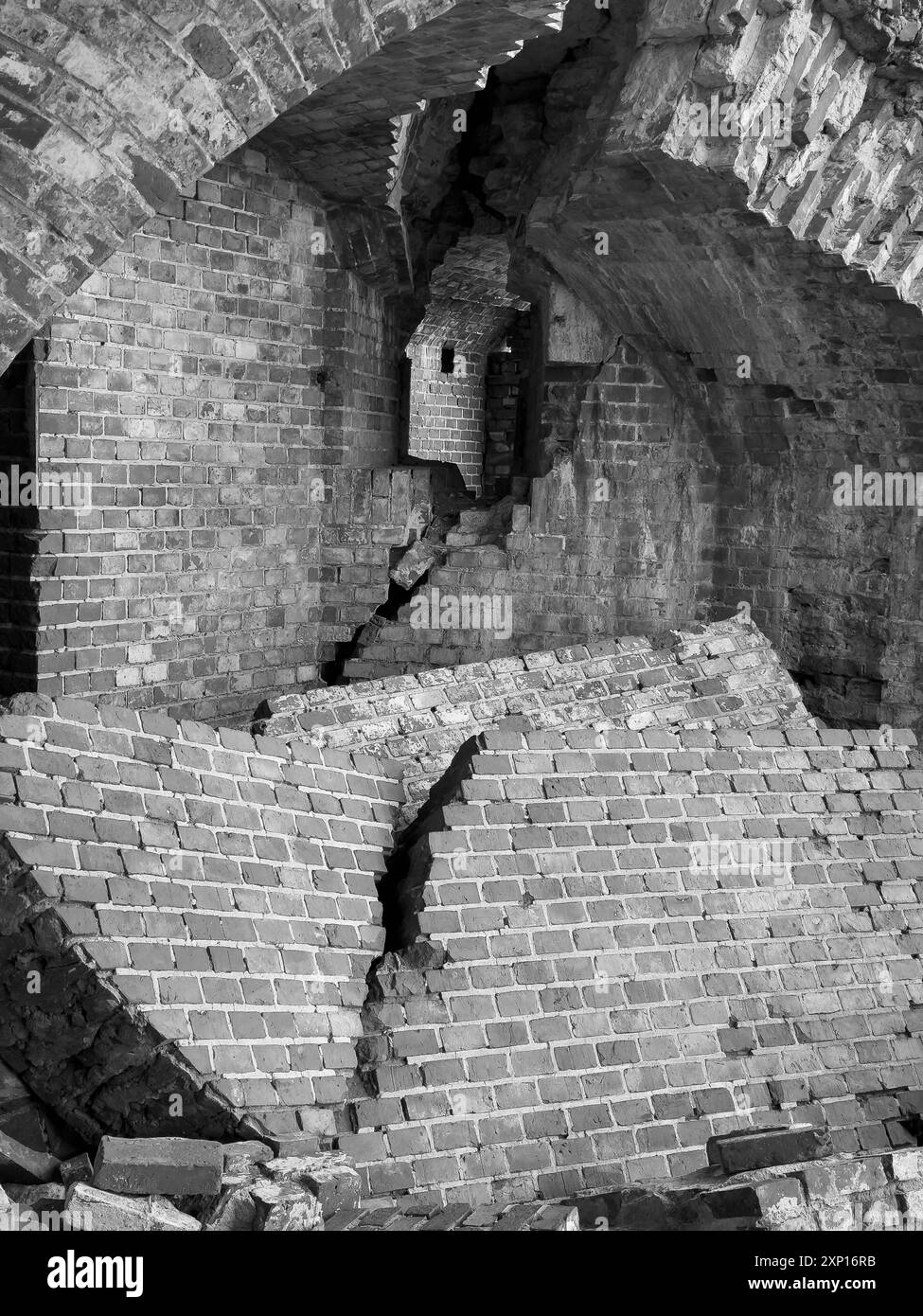 Black and white image of crumbling brick wall in ancient ruined ...