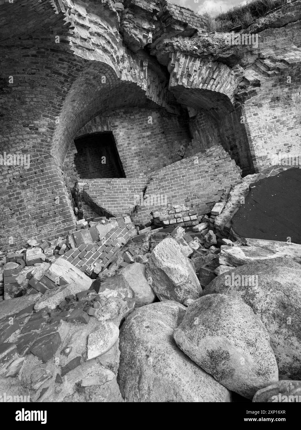 Black and white image of a deteriorating brick arch structure with ...