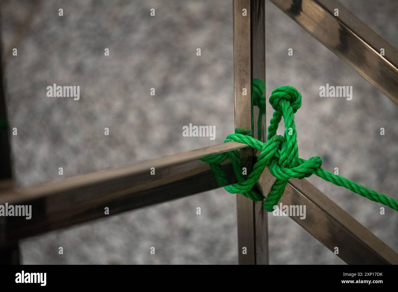 Nylon rope knot on a steel pole. India Stock Photo - Alamy