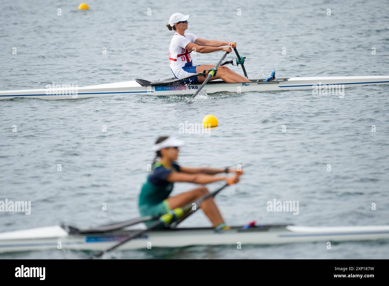 Jovana Arsic, of Serbia, top, competes in the women's single sculls ...