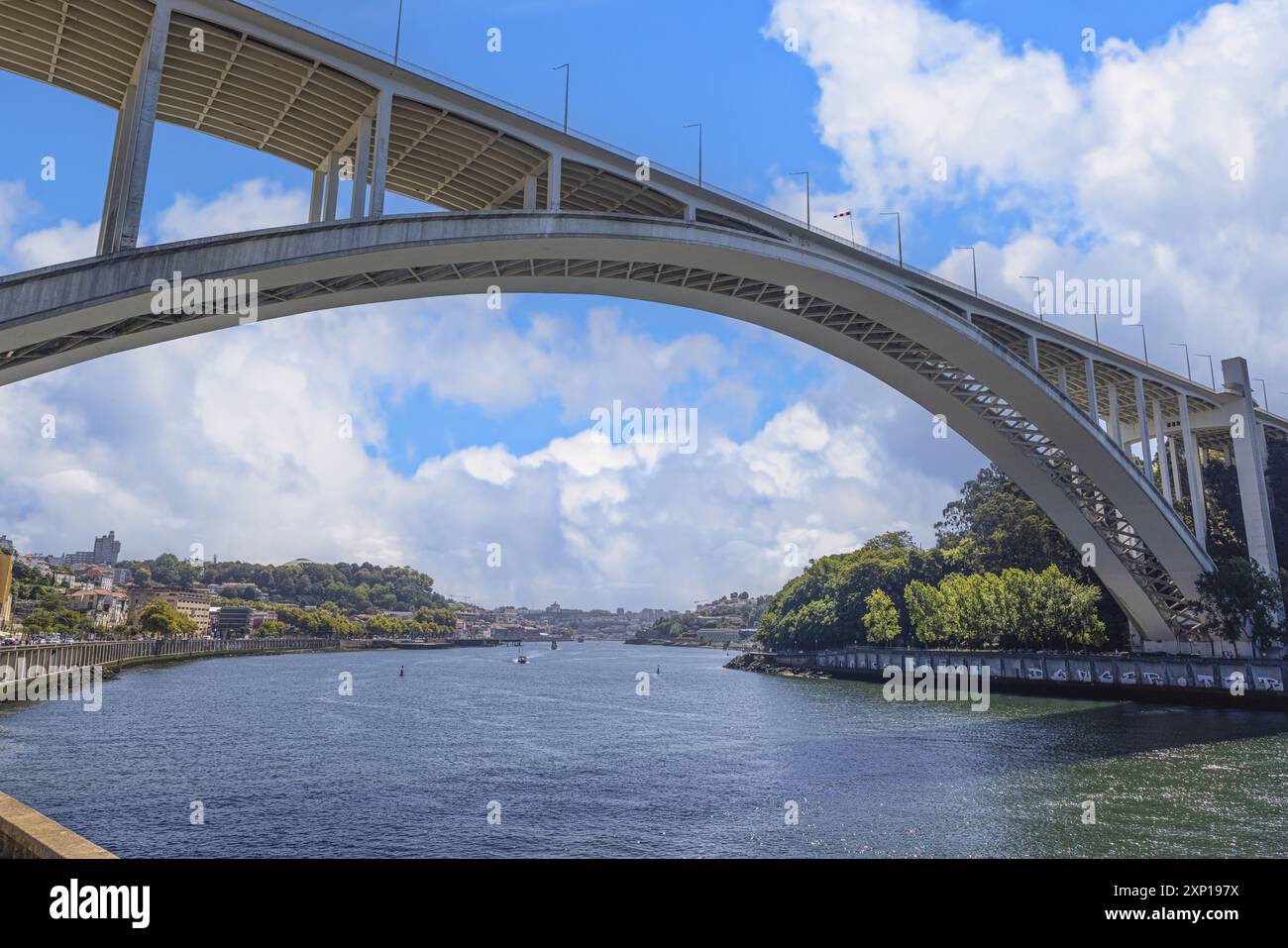 A high-angle view of a bridge spanning a body of water, connecting two ...
