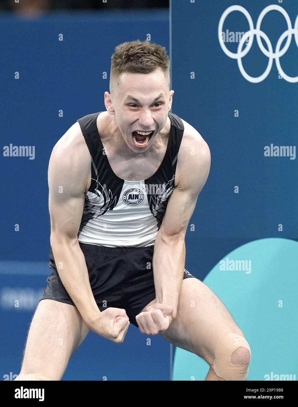 Individual neutral athlete Ivan Litvinovich from Belarus reacts after ...