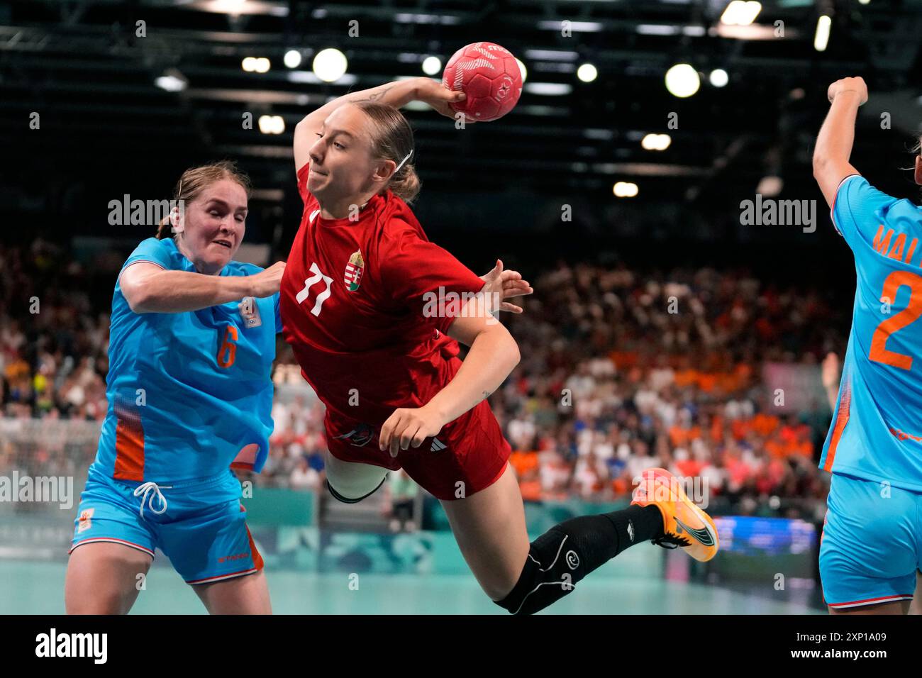 Petra Simon, of Hungary, attempts to score, during the women's handball match against the ...