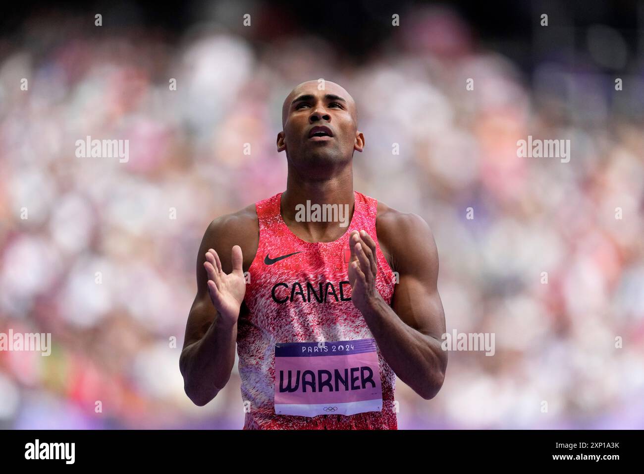 Damian Warner, of Canada, reacts after finishing his decathlon 110 ...