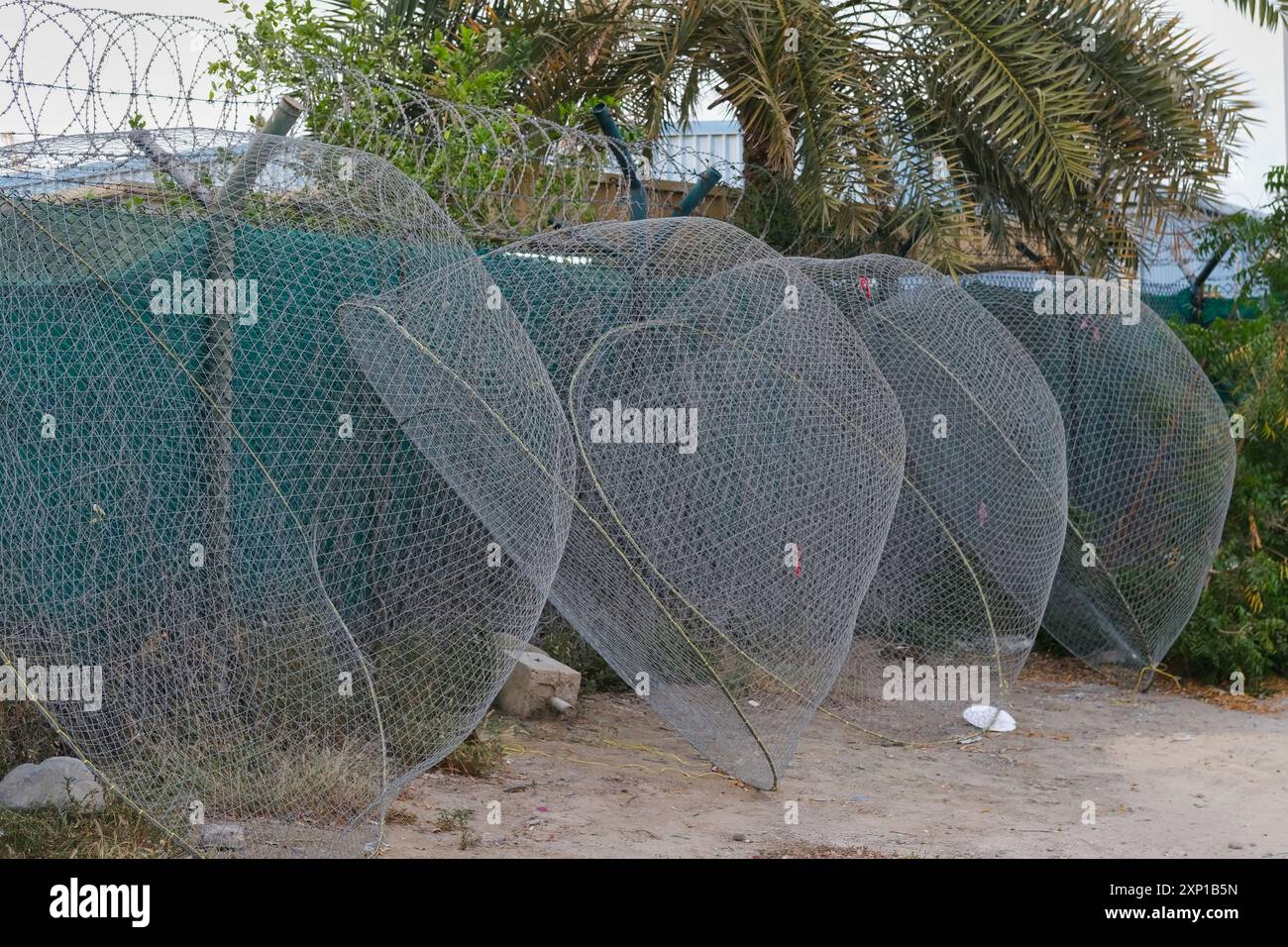Traditional middle eastern half-ball basket fishing traps made of metal ...