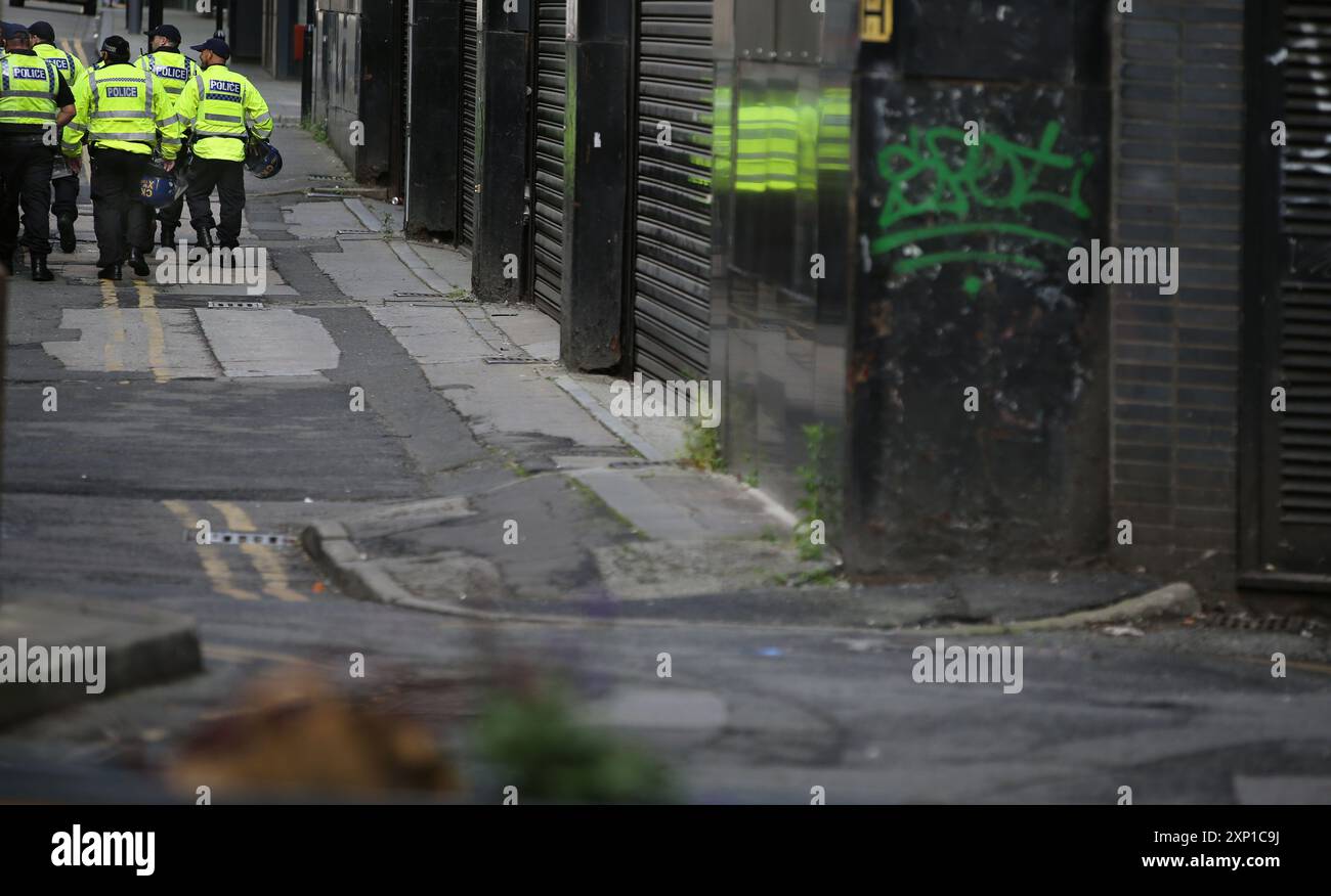 Manchester, England, UK. 3rd Aug, 2024. Police officers with riot ...