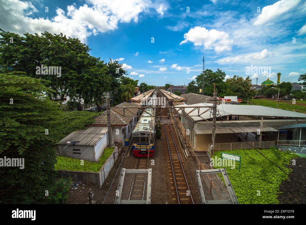 KRL Jakarta Commuter Train stop at the station Stock Photo - Alamy