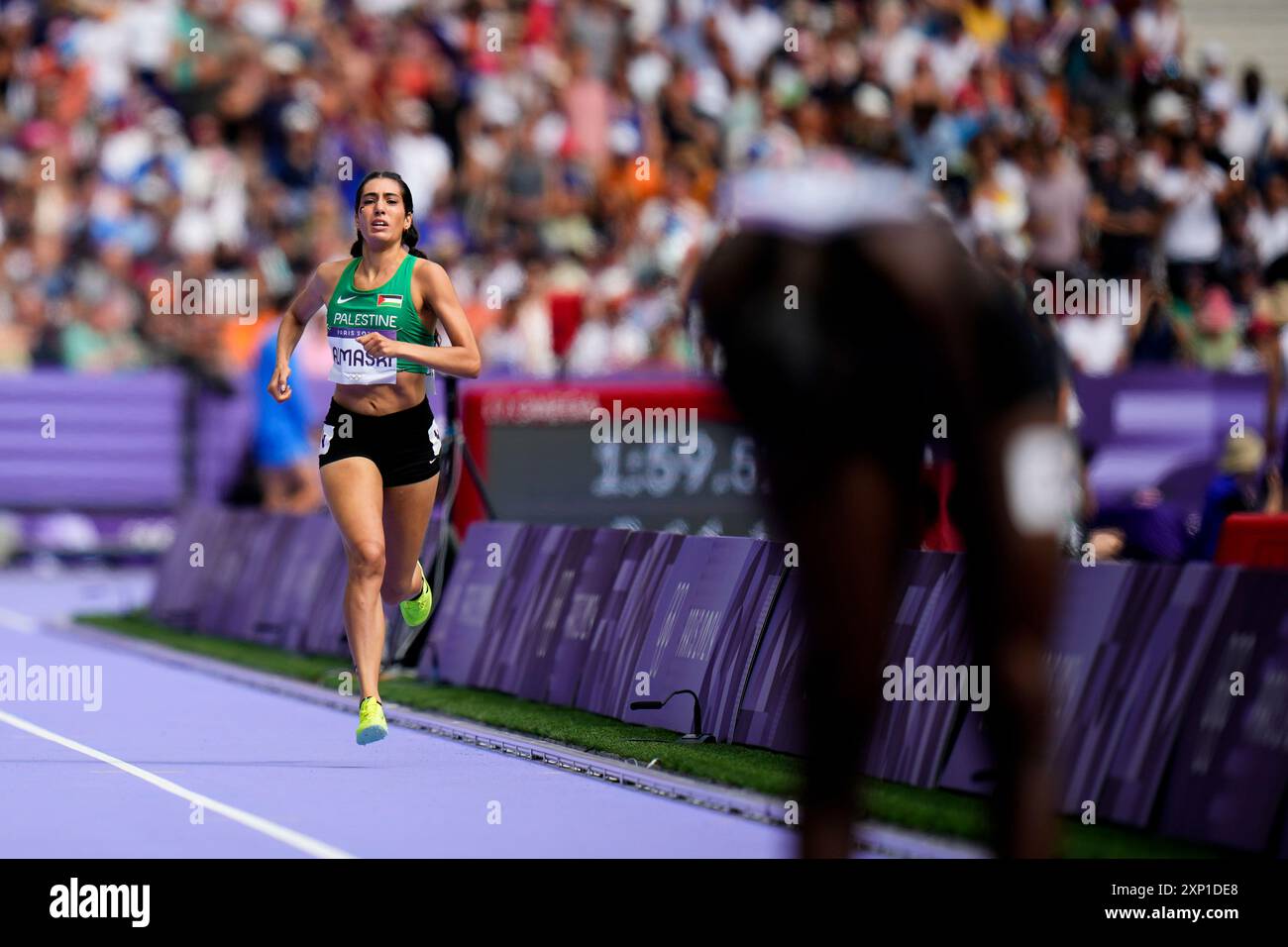 Layla Almasri, of Palestine, finishes a heat in the women's 800-meter ...