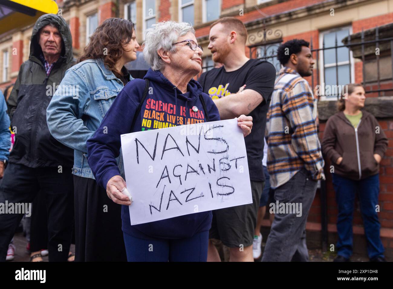 Liverpool, UK. 02 AUG, 2024. Lady holds "Nans Against Nazis" sign as ...
