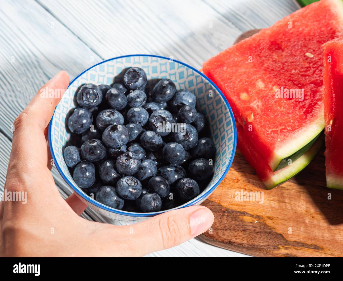Seedless watermelon and blueberries on wooden background, summer fruit ...