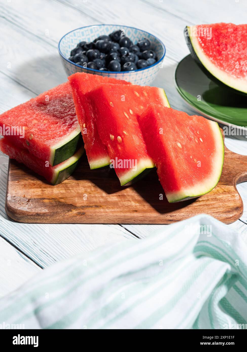 Seedless watermelon and blueberries on wooden background, summer fruit ...