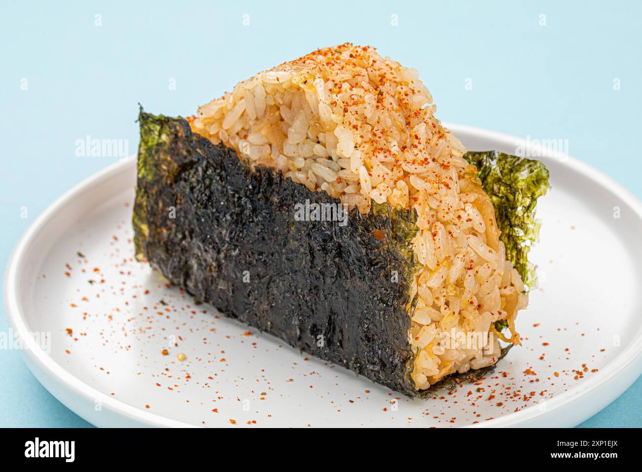 Portion of japanese onigiri snack with spices Stock Photo - Alamy