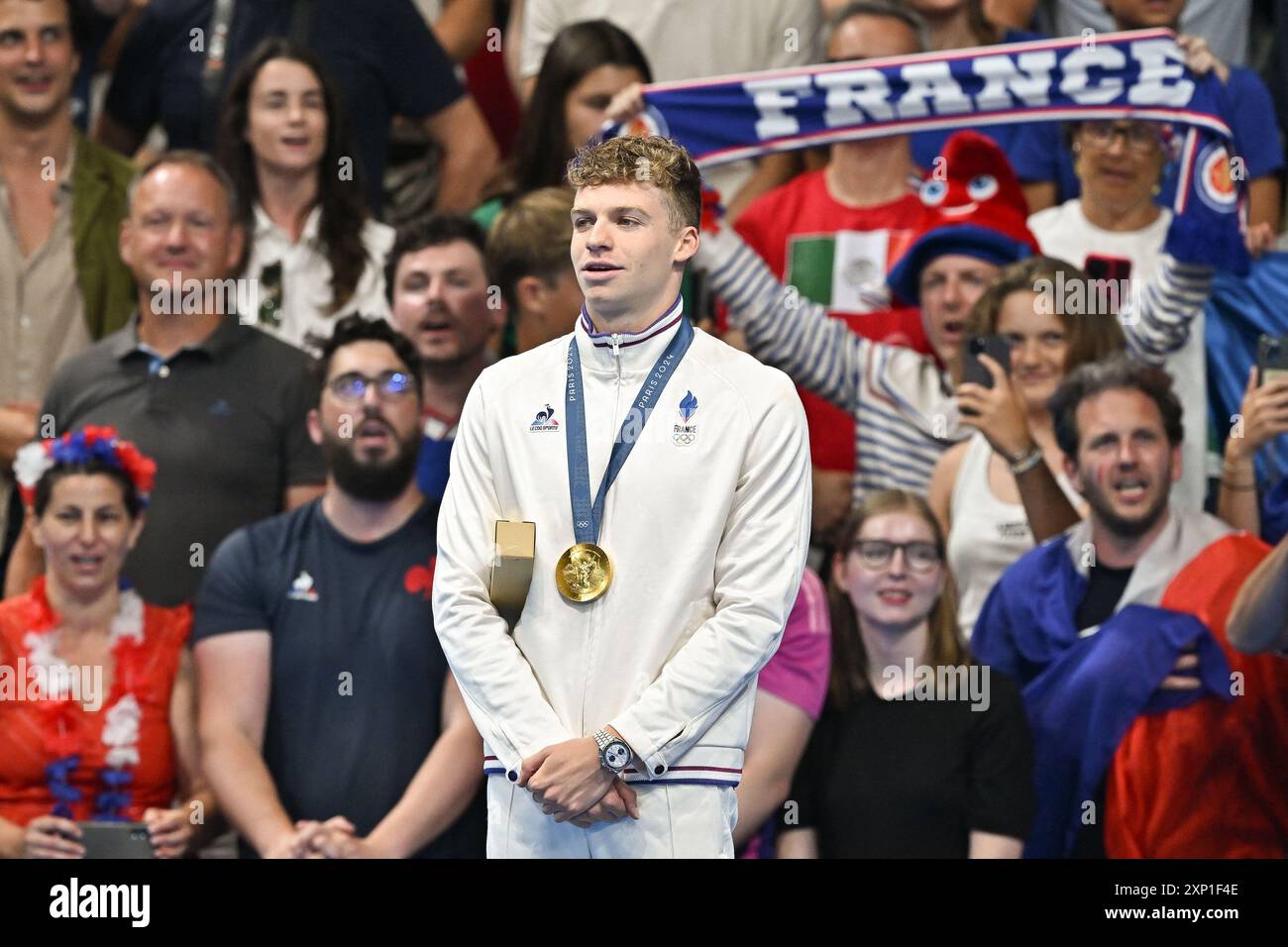 Leon Marchand of Team France celebrates after winning the gold medal in ...