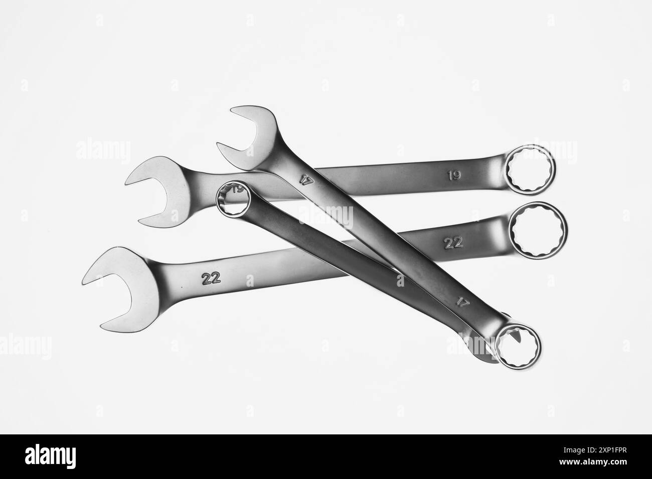 Set of ratcheting wrenches on white background, top view. Auto mechanic ...