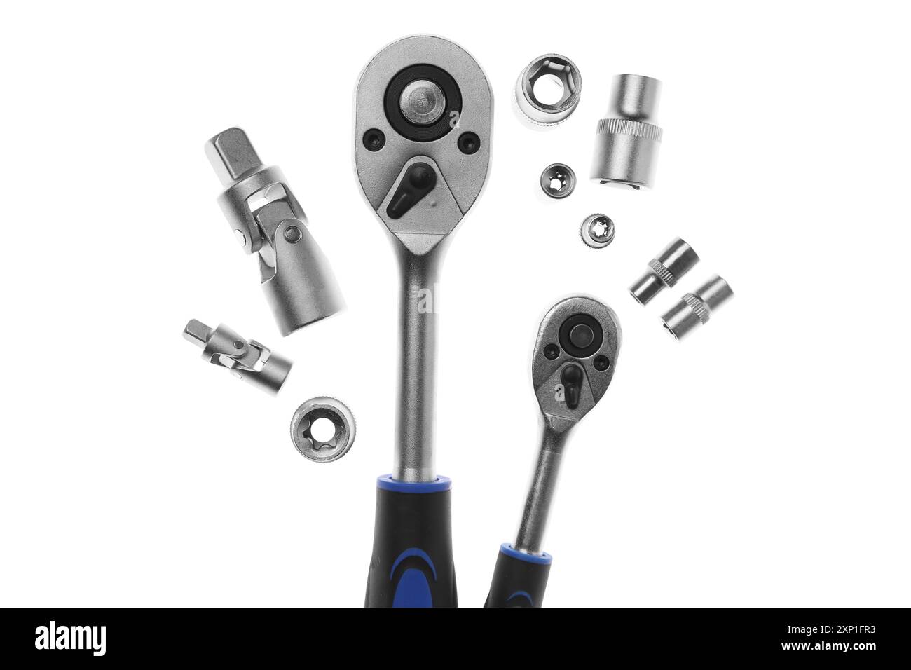 Two torque wrenches and nuts on white, flat lay. Auto mechanic tools ...