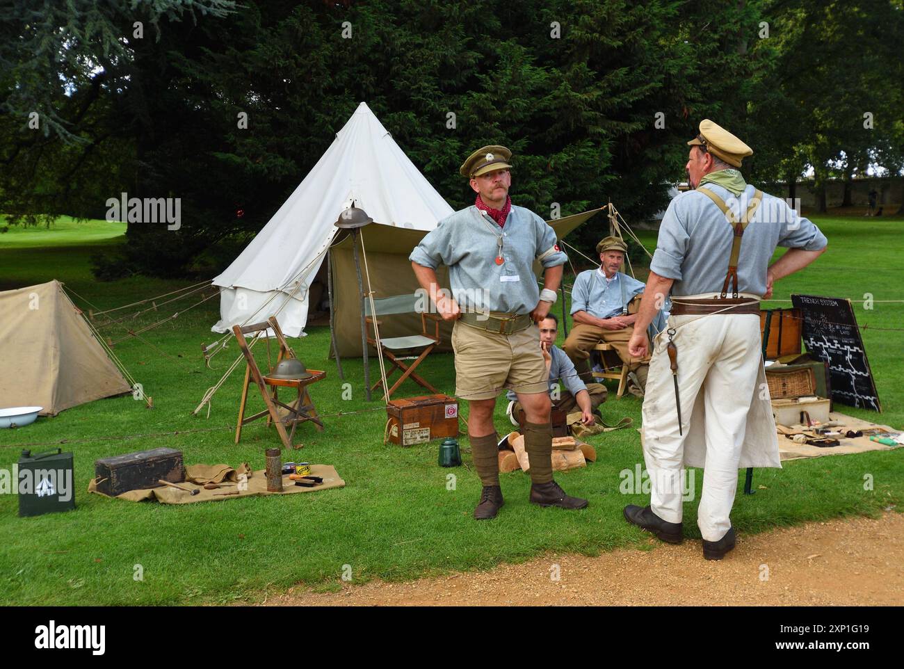 Four men in first world war uniforms in front of tents Stock Photo - Alamy