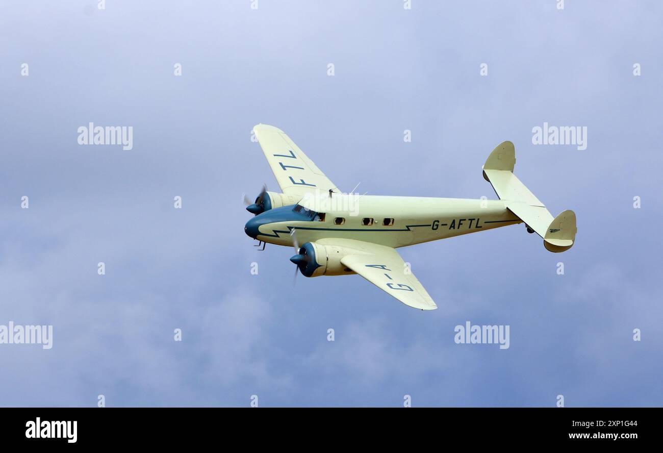 Vintage Lockheed 12A Electra Junior in flight Stock Photo - Alamy