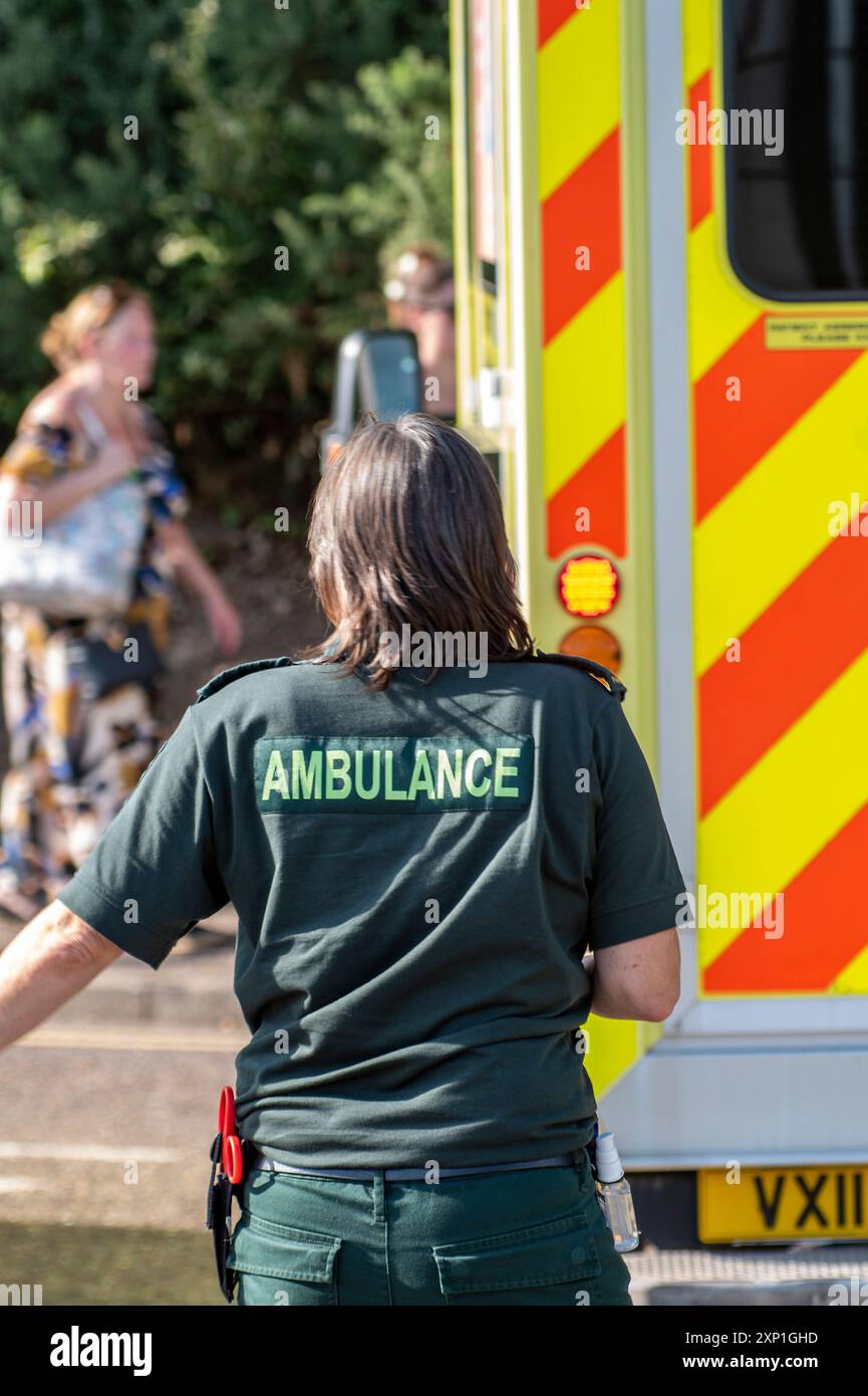 ambulance paramedic on scene at an emergency medical situation next to ...