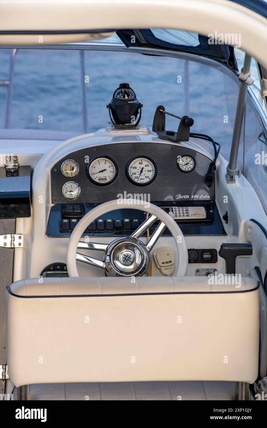 modern motorboat or motor yacht control console and helm. steering ...