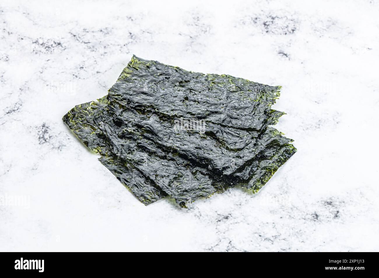 Korean nori seaweed chips heap snack Stock Photo - Alamy