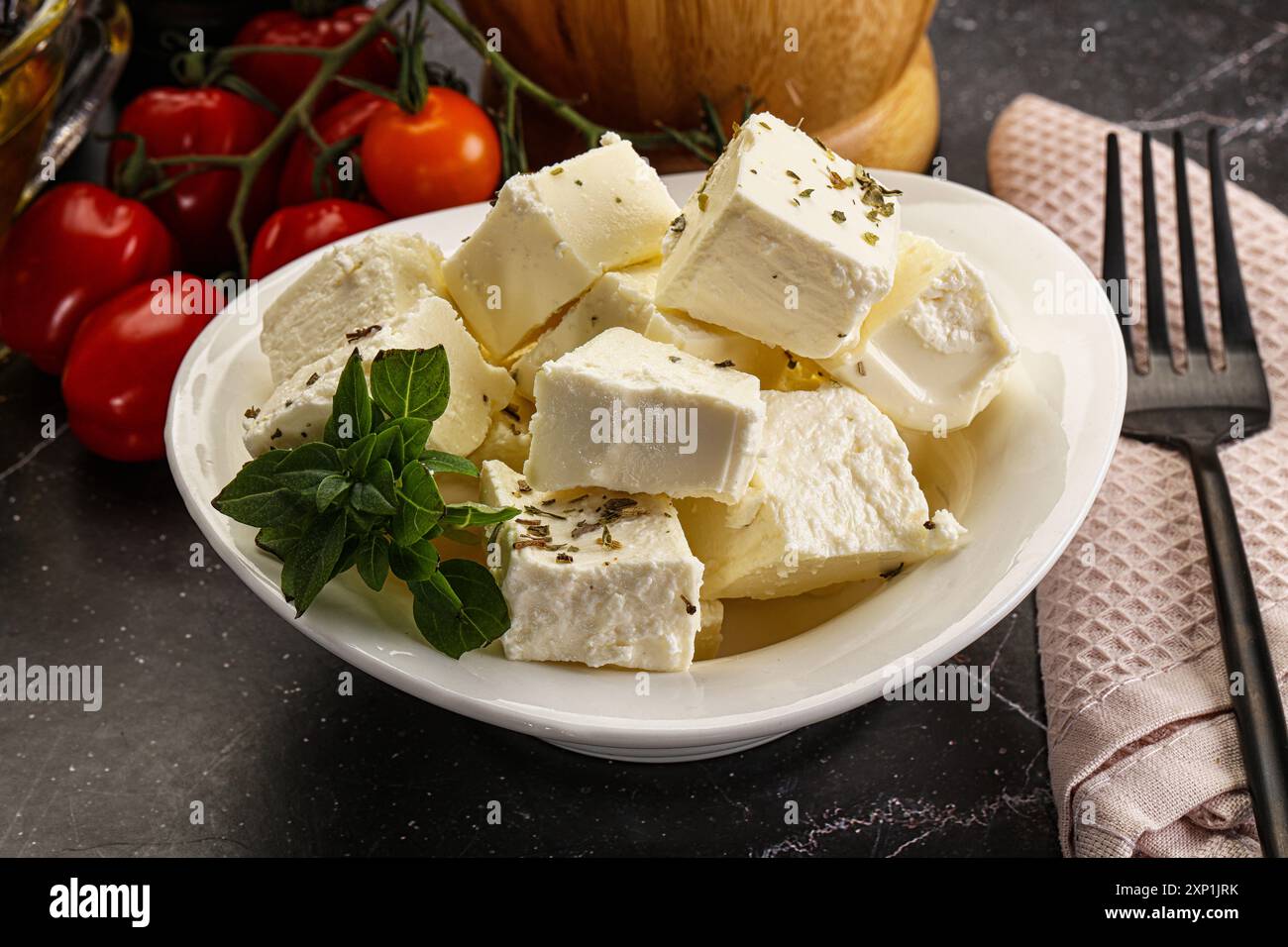 Greek traditional Feta cheese cubes with herbs and spices Stock Photo ...