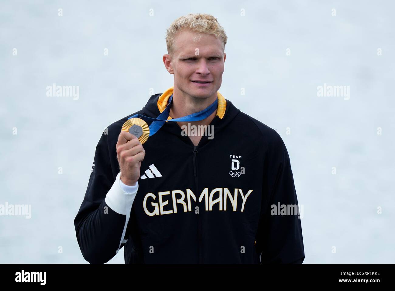 Oliver Zeidler, of Germany, poses with the gold medal in the men's ...