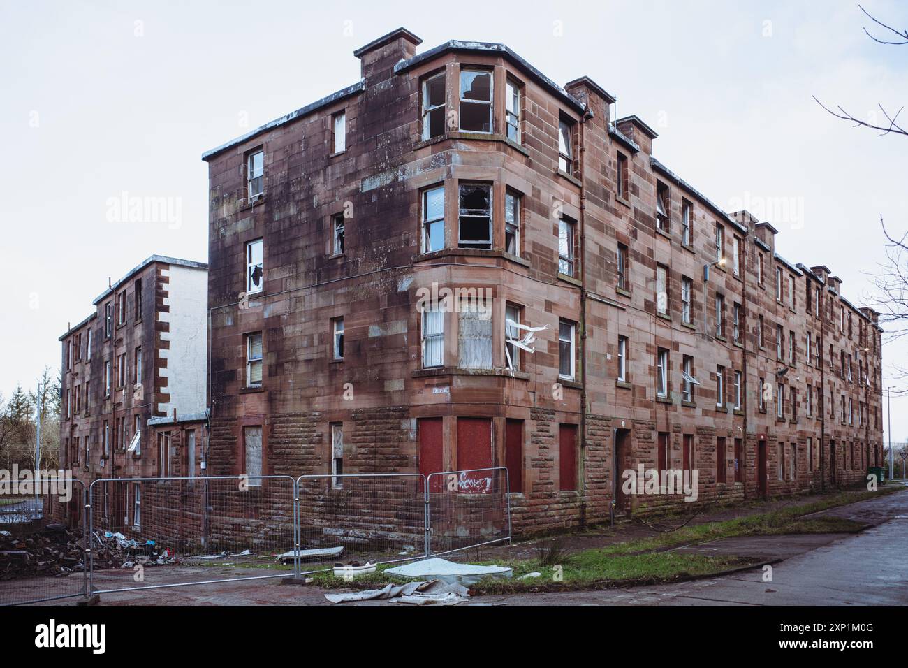 Corner of abandoned and derelict tenement block in the eerie Clune Park ...
