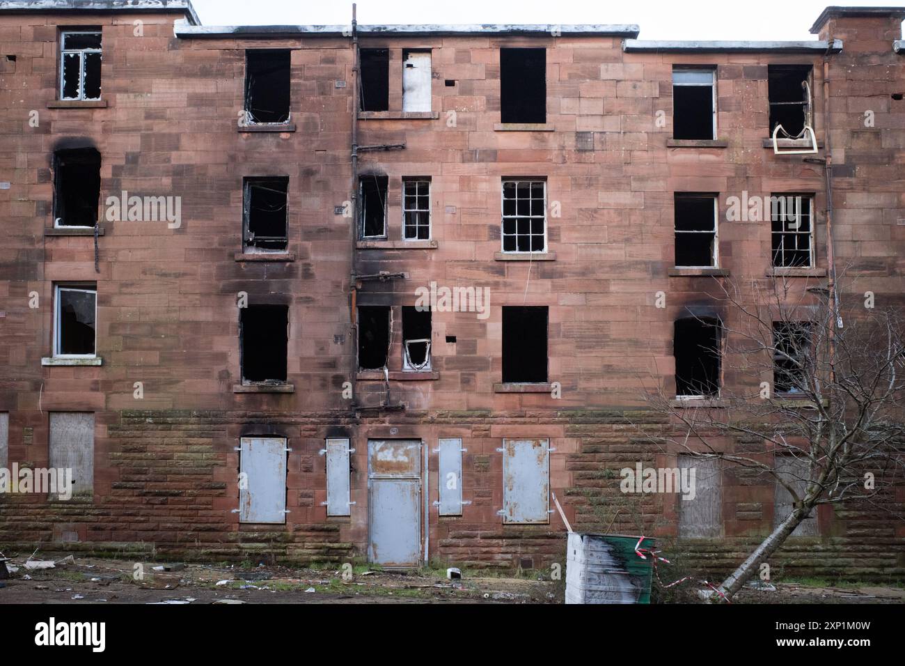Derelict and burnt out facade of Scottish Tenement building in Clune ...