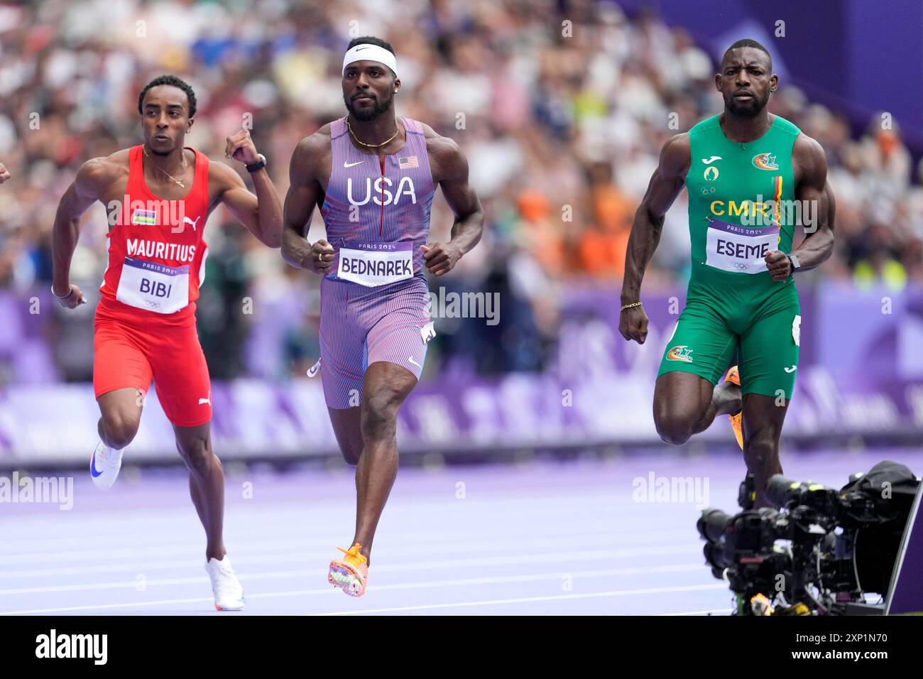 Kenneth Bednarek, of the United States, and Emmanuel Eseme, of Cameroon ...