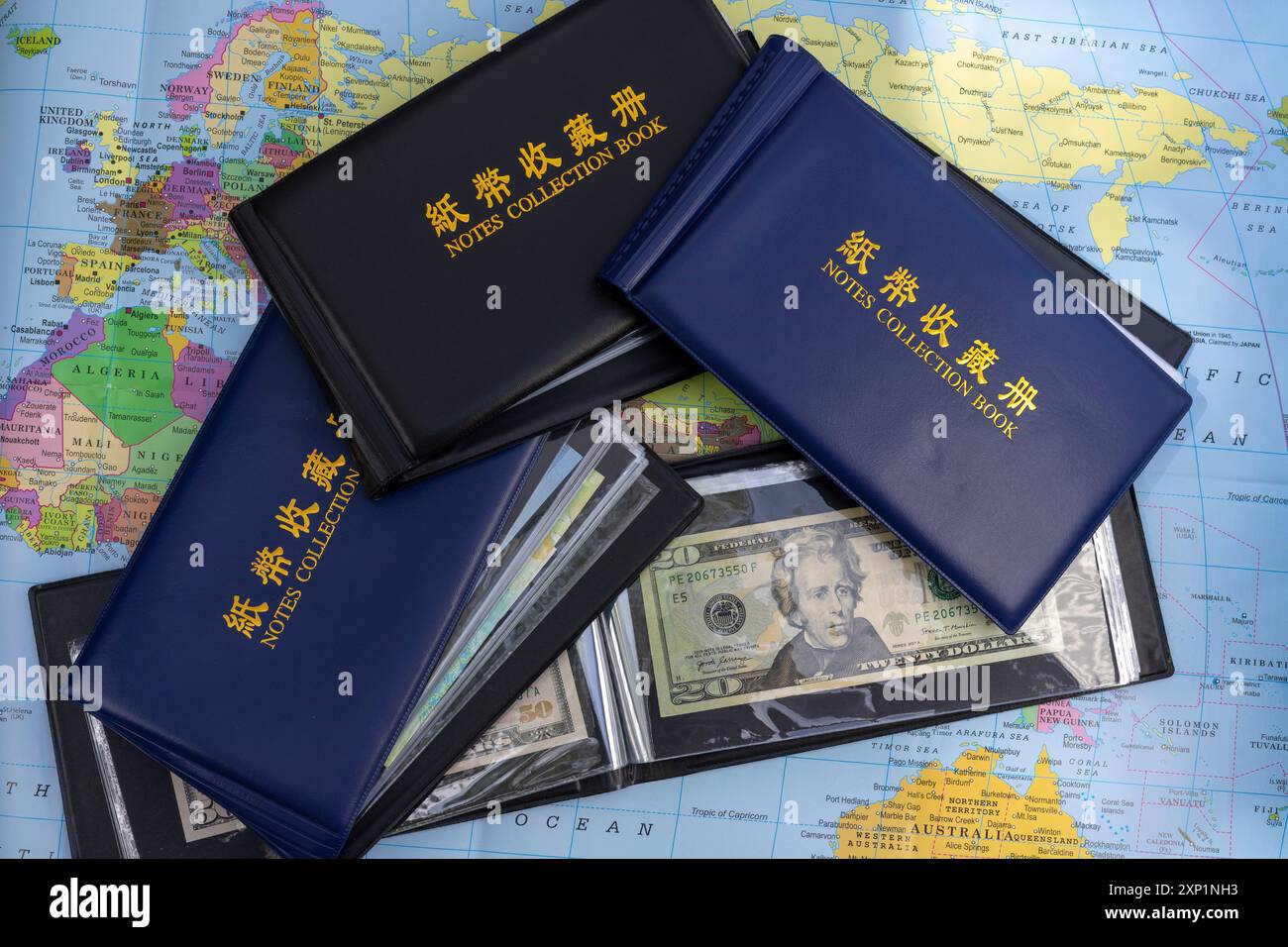 Currency Collectors Album with Banknotes on Map Stock Photo - Alamy