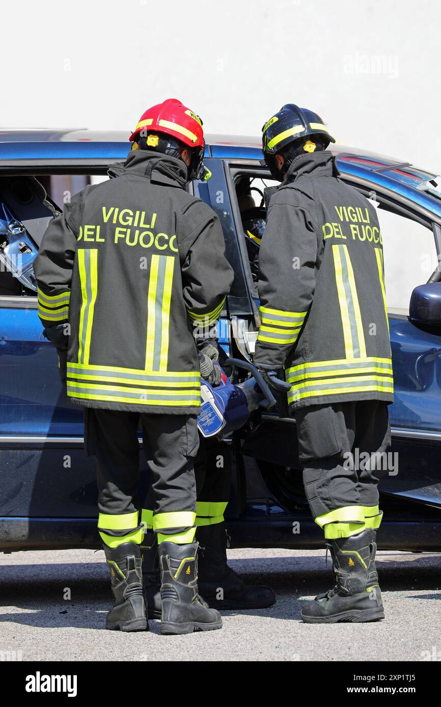 Vicenza, VI, Italy - May 23, 2024: Two firefighters using the Jaws of ...
