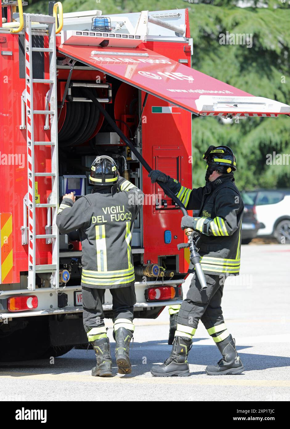 Vicenza, VI, Italy - May 23, 2024: ITalian Firefighters take the hose ...