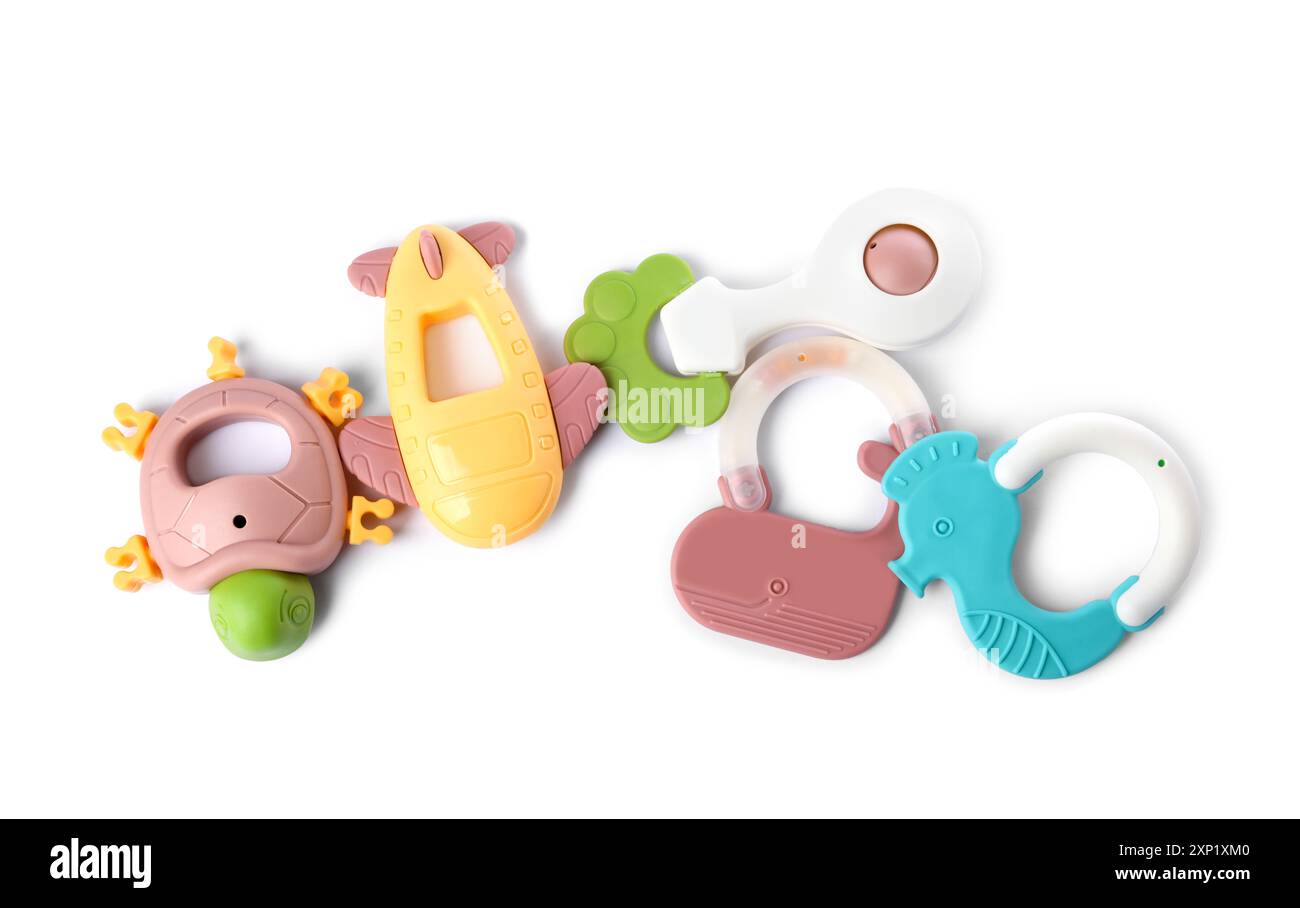 Colorful rattles isolated on white, top view. Baby accessories Stock ...