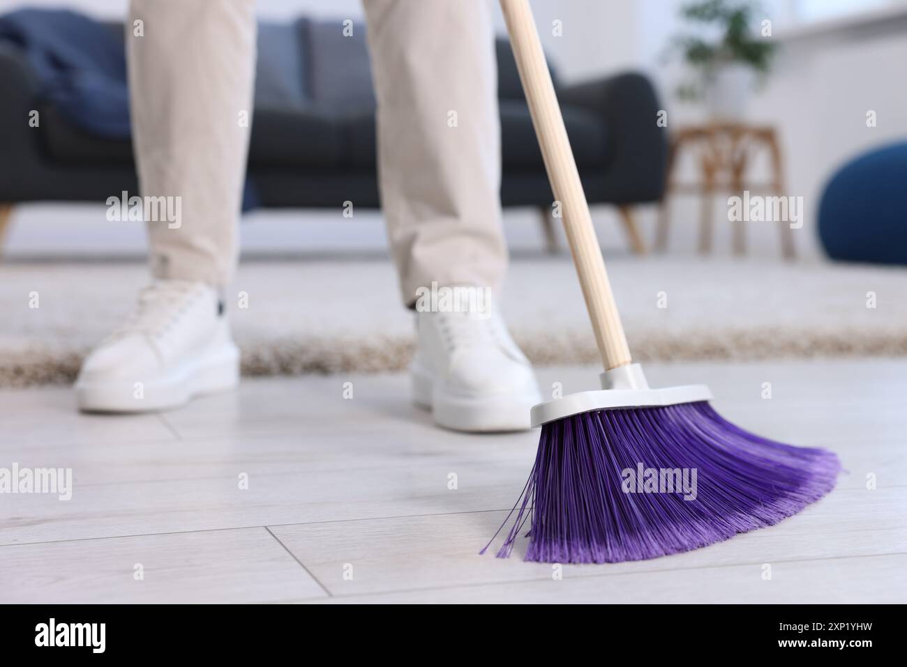 Woman with broom sweeping hi-res stock photography and images - Alamy