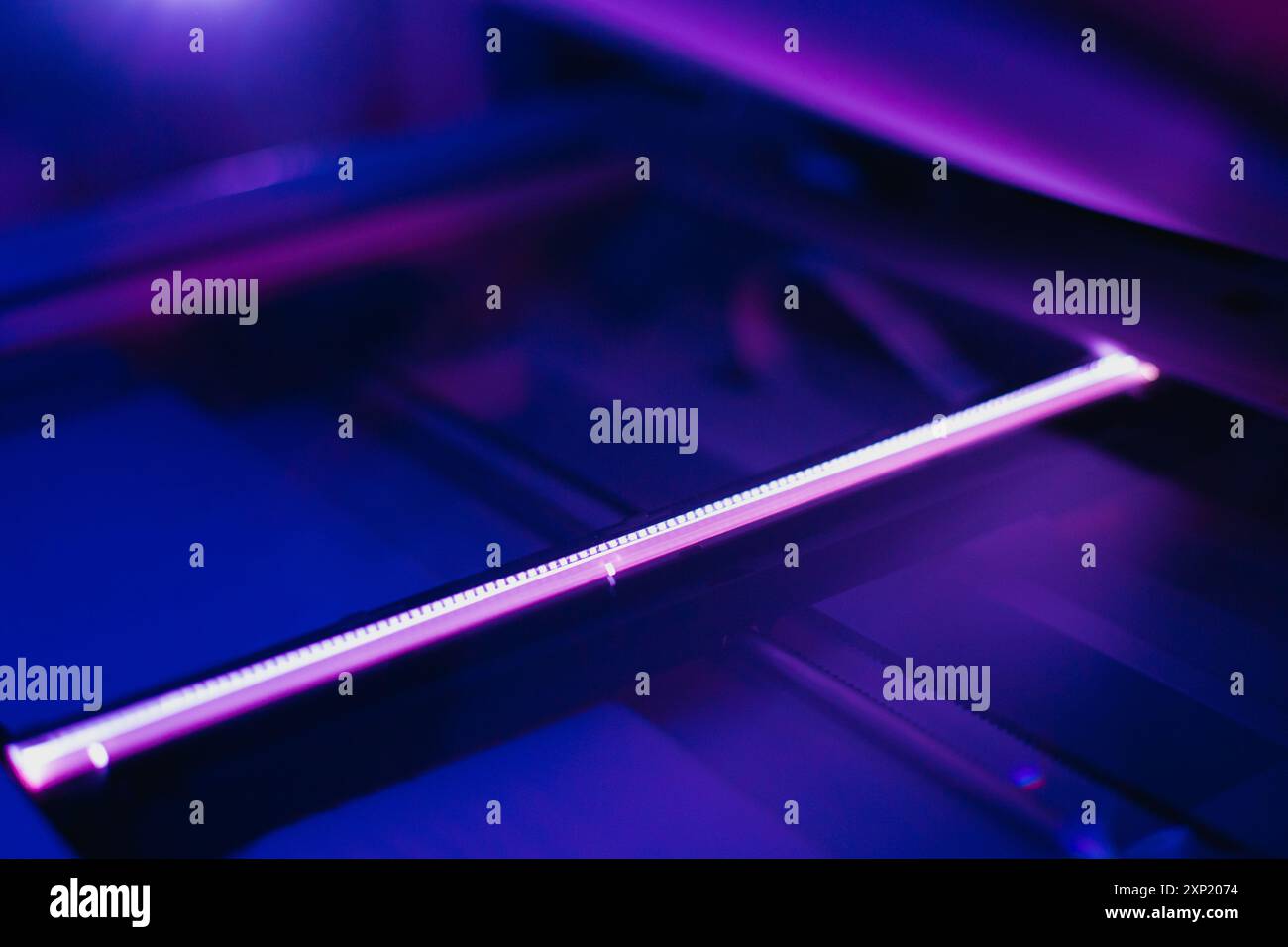 Copier scanner with a bright light inside. Office hazards concept ...