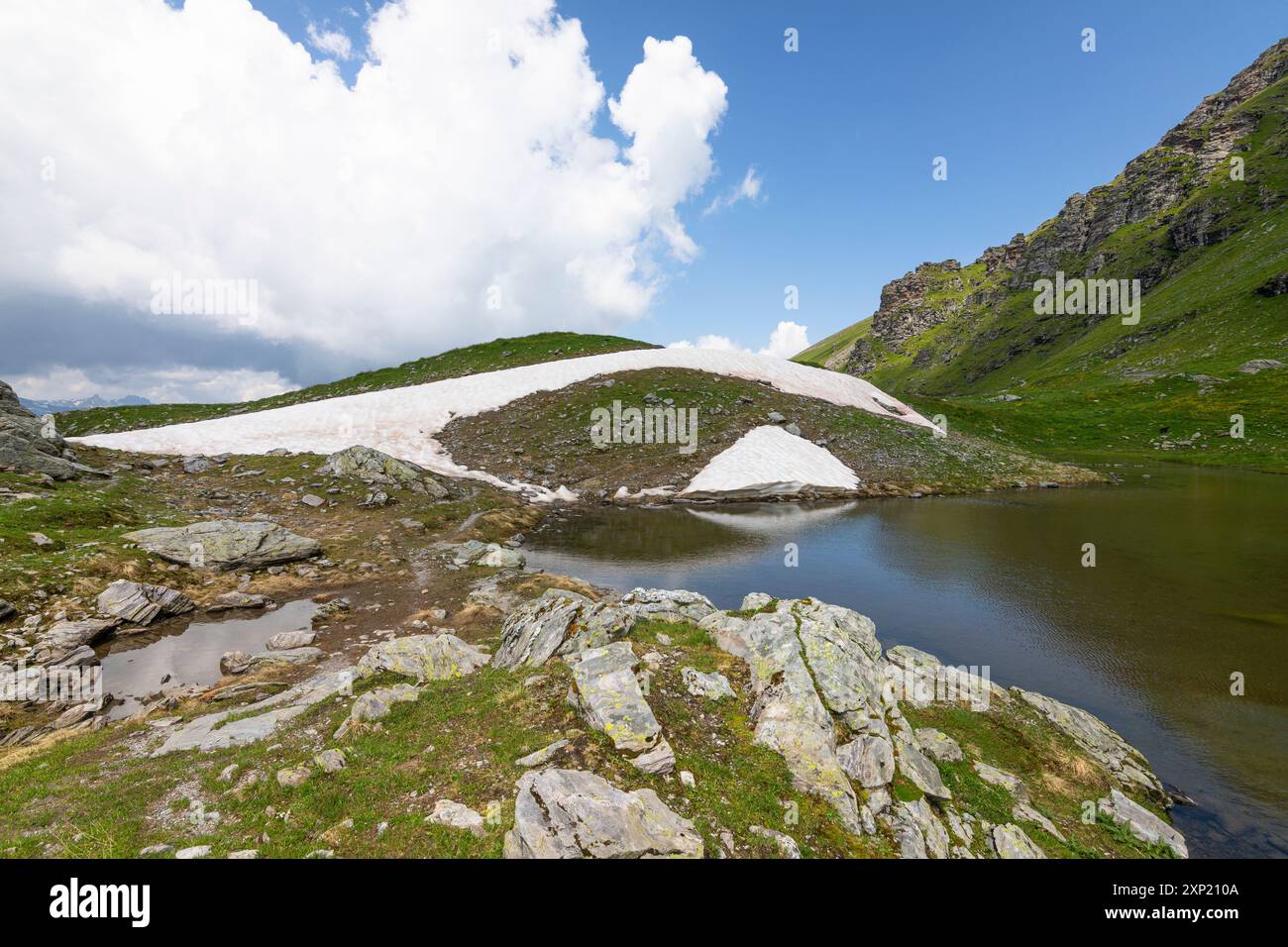 Small lake with a glacier at the 5 lakes Hike, at Pizol mountain ...