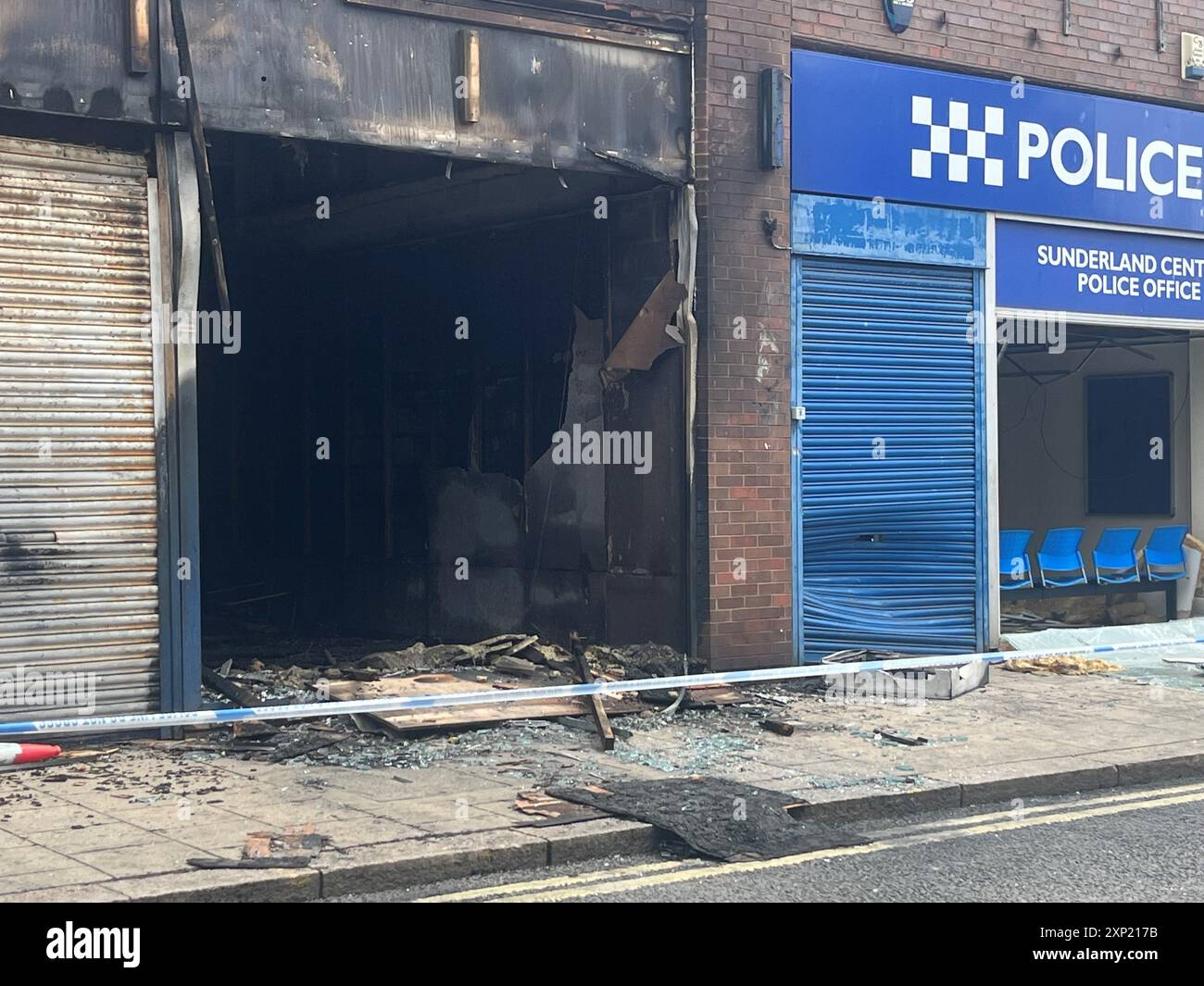 A fire-damaged Citizen's Advice Bureau office as local people prepare ...