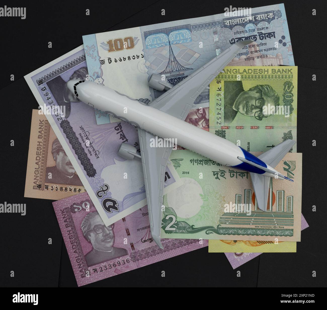 Toy Airplane on Assorted Bangladeshi Banknotes Stock Photo - Alamy