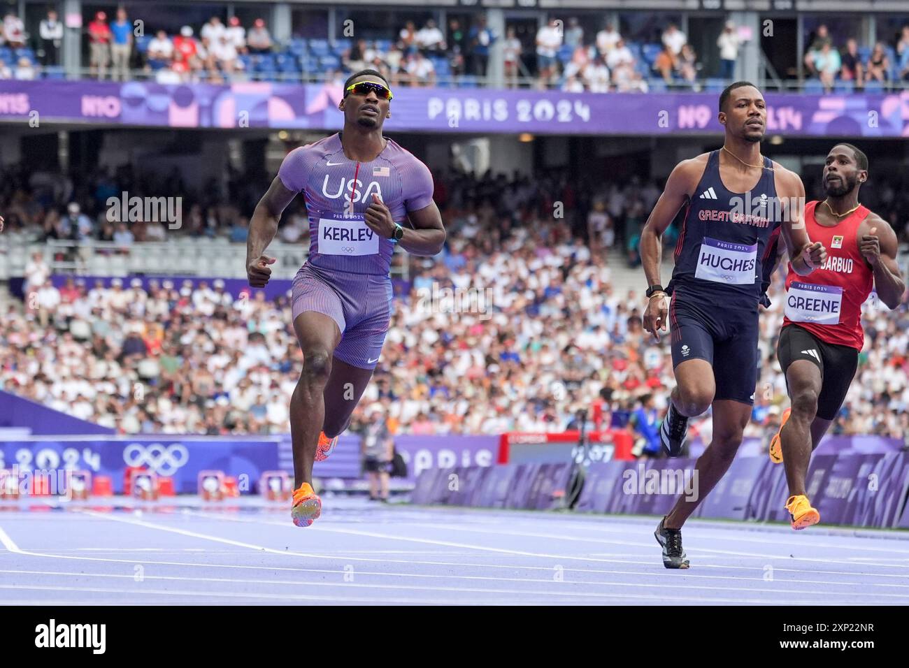 Fred Kerley, left, of Team USA runs in the men's 100 meter round 1 race at the Stade de France ...