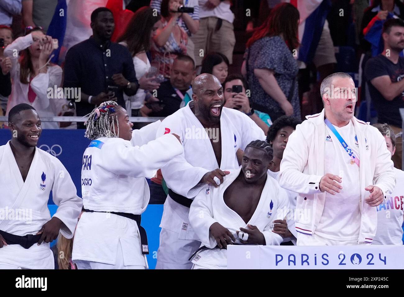France athletes celebrate their victory at the mixed team semifinal ...