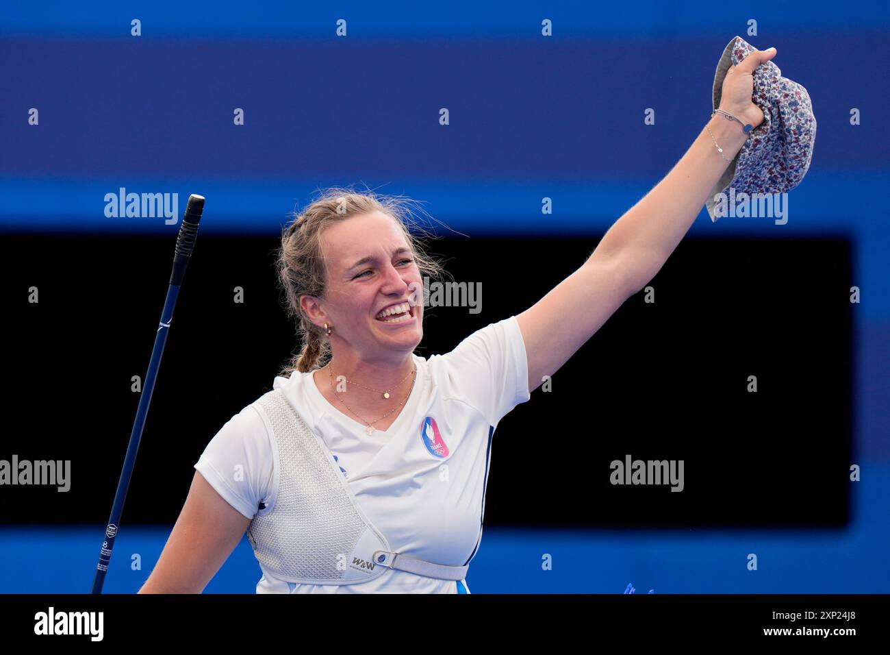 France's Lisa Barbelin celebrates after winning the women's archery ...