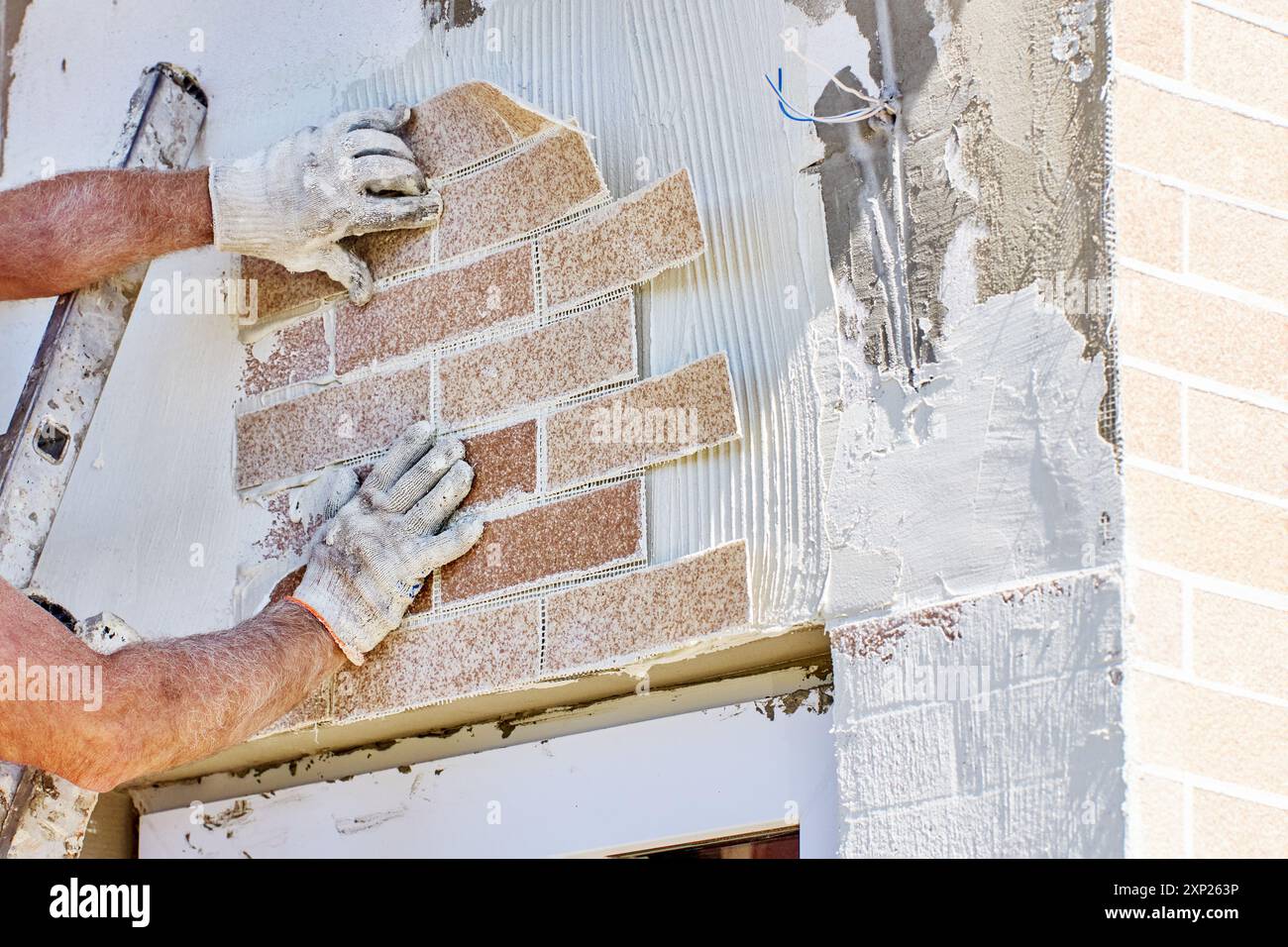 DIY faux brick wall, house painter glued panel with imitation bricks on ...
