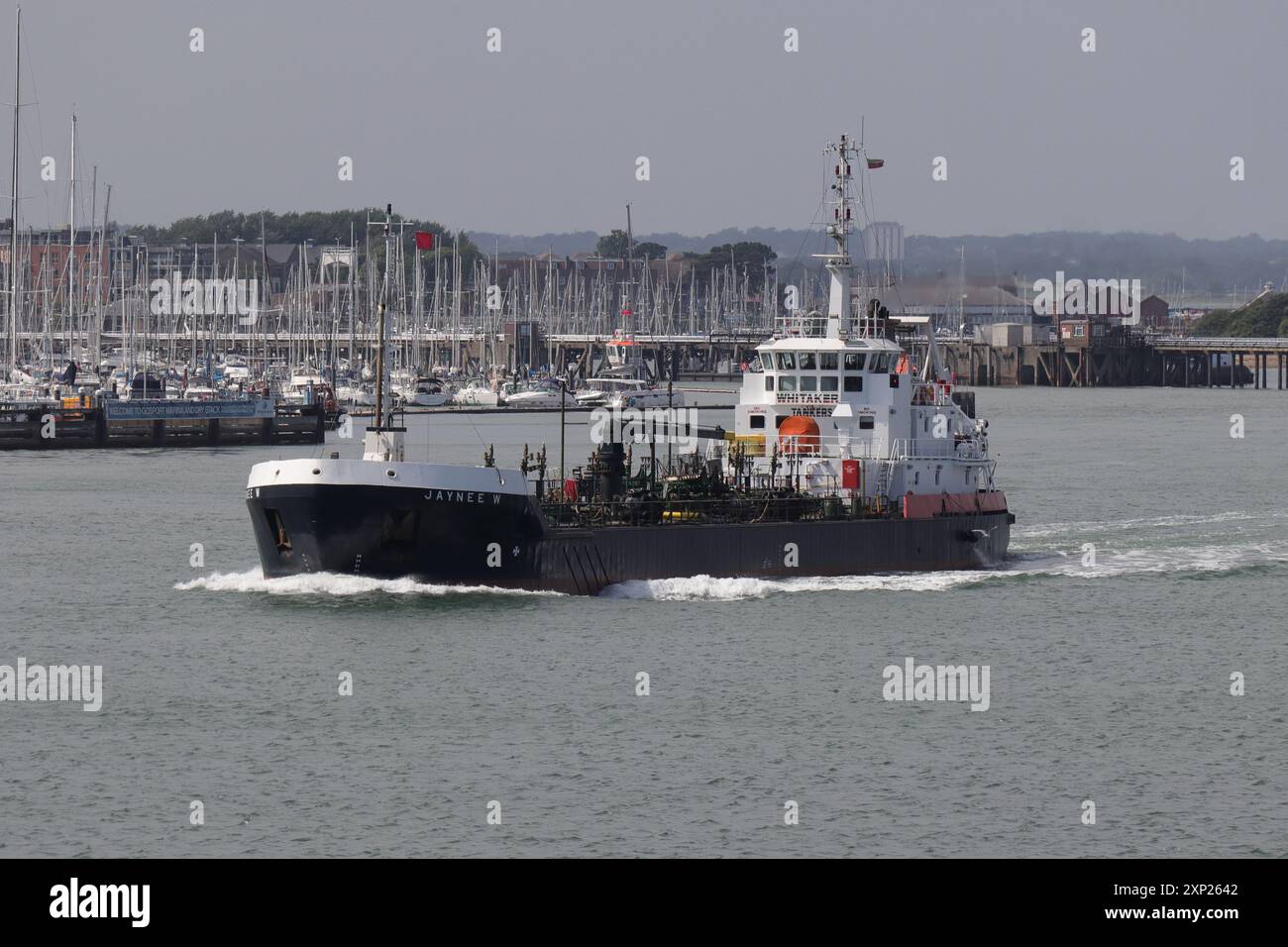 The oil products tanker MV JAYNEE W leaving harbour. The ship is ...