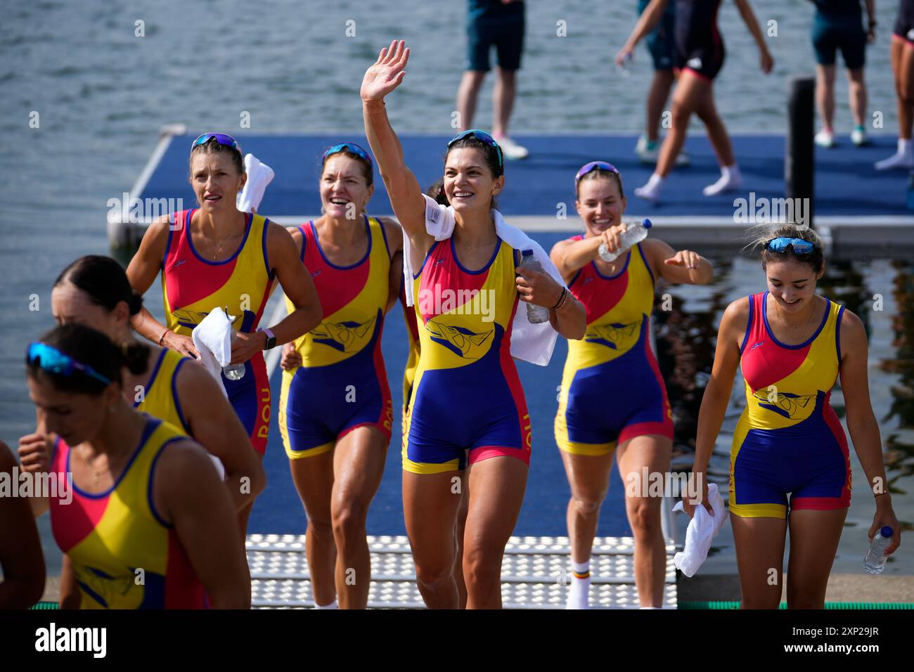 Members of Team Romania celebrate gold in the women's eight rowing ...